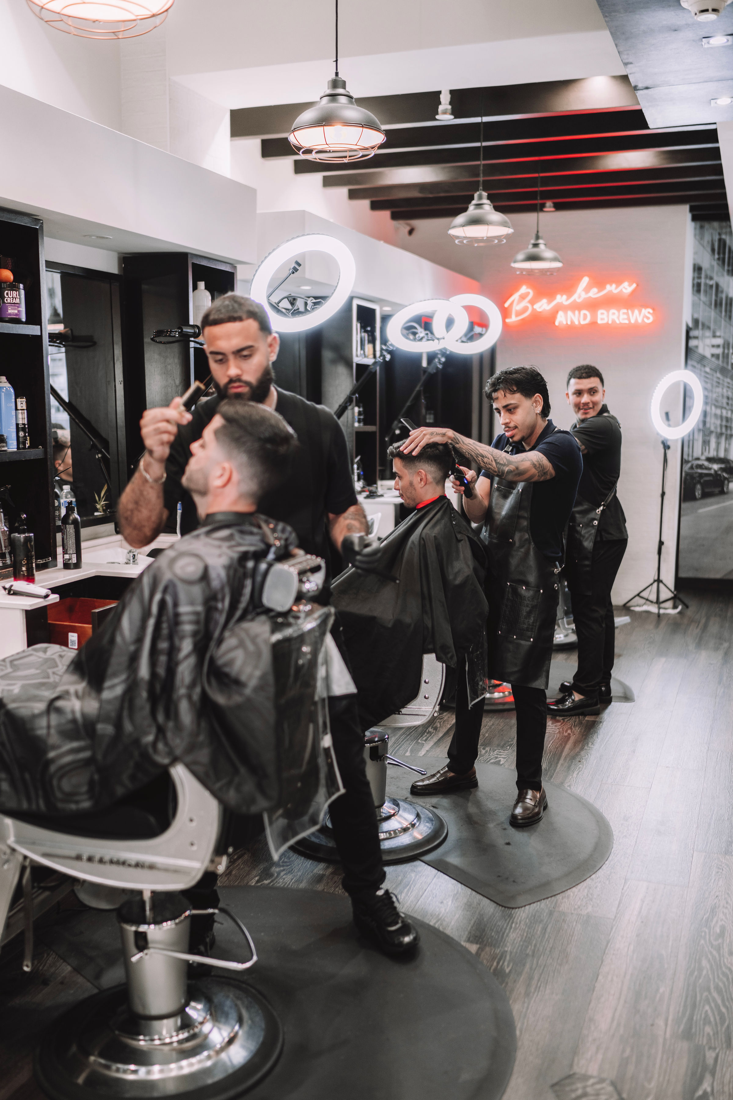 Full barbershop experience with multiple barbers at work